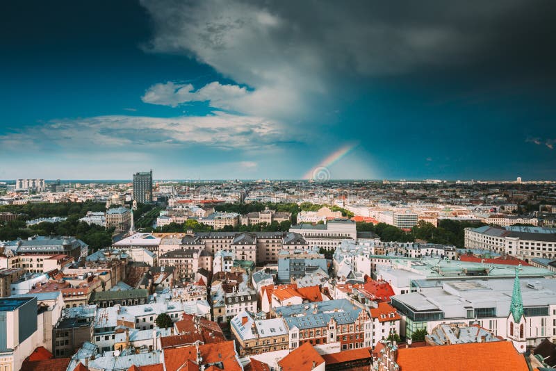 Riga, Latvia. Rainbow during Summer Rain Over Riga Cityscape Skyline ...