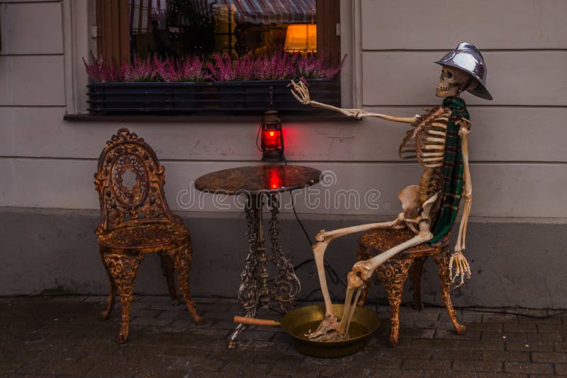 RIGA, LATVIA : Skeleton of Fireman As Decoration in Cafe, Outdoor ...