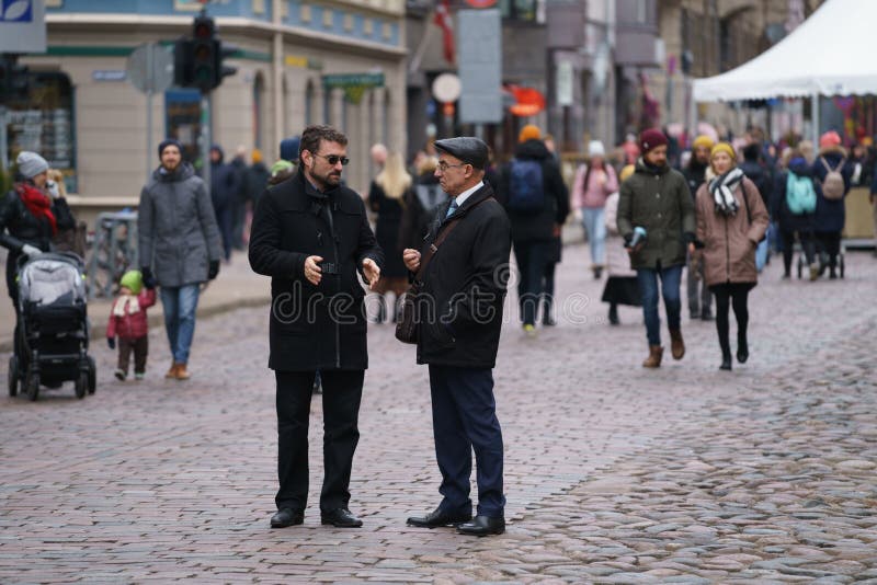 10-02-2020 Riga, LAtvia Two Men Talking in the Middle of the Street ...