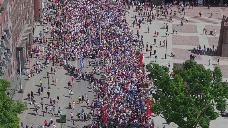 Riga Rimi Marathon 2024. Aerial View on Crowd of People Running through ... Riga Rimi Marathon 2024. Aerial View on Crowd of People Running through ...