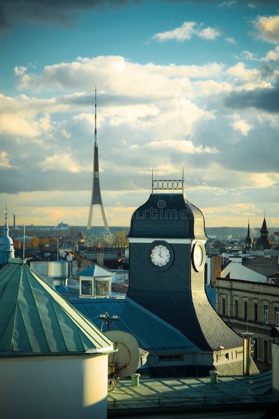 Riga rooftops, clock tower stock photo. Image of rooftop - 25157762
