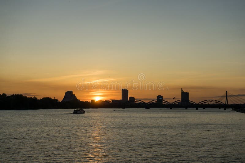 Riga at sunset, Latvia stock photo. Image of sunset - 157130508