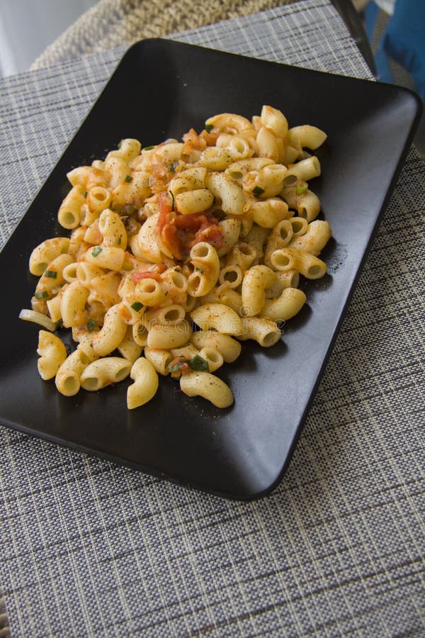 Rigati pasta on plate stock photo. Image of leaves, fork - 63558234