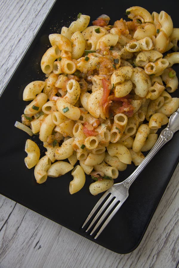 Rigati Served on Black Plate Stock Image - Image of dish, green: 58512233