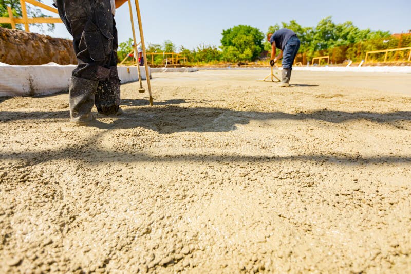 Rigger Checks Height of the Concrete after Casting into Building ...