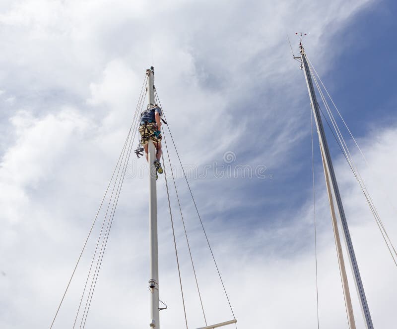 Rigger in a sailboat mast stock image. Image of rope - 102370977