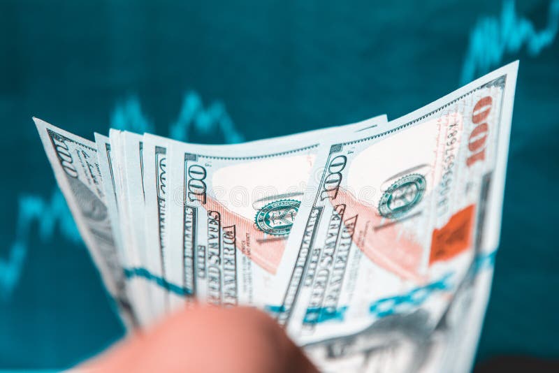 Right Hand Holds Stack of 100 Dollars Banknotes on Black Background ... Right Hand Holds Stack of 100 Dollars Banknotes on Black Background ...