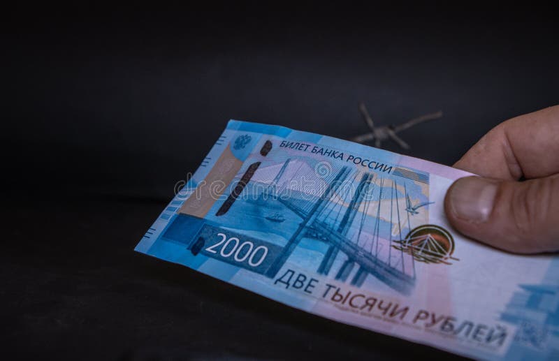 Right Hand Holds Stack of 2000 Russia Ruble Banknote on Black ... Right Hand Holds Stack of 2000 Russia Ruble Banknote on Black ...