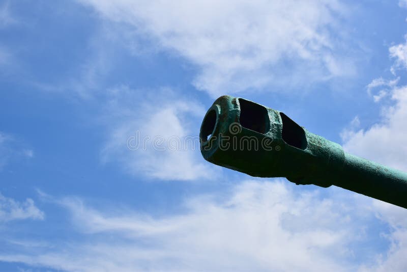 On the Right Side of the Frame, the Muzzle of a Tank or Cannon is ...