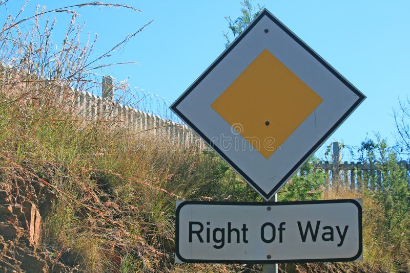 RIGHT of WAY ROAD SIGN stock photo. Image of road, green - 124358748