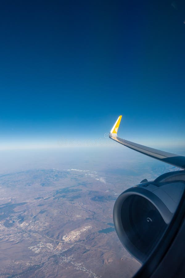 The Right Wing of the Plane Rises into the Blue Sky Stock Photo - Image ...
