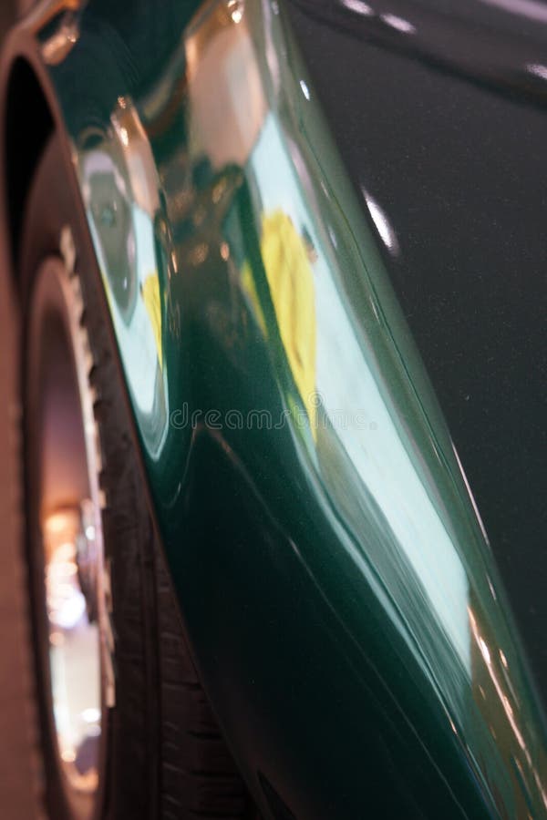 Right Wing and Wheel of a Green Car Stock Photo - Image of wheel, light ...
