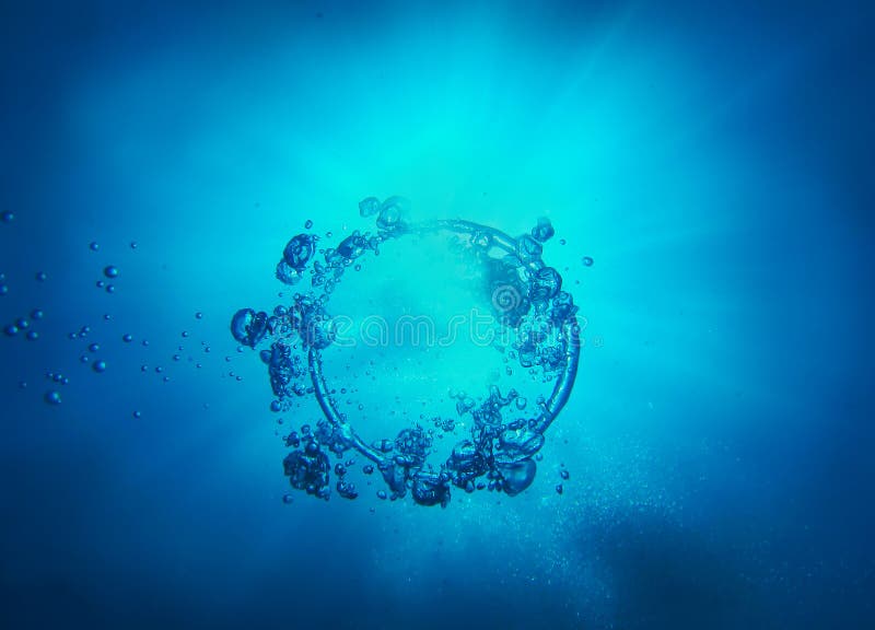 Ring and Bubbles from Air in Water Stock Photo - Image of effects ...