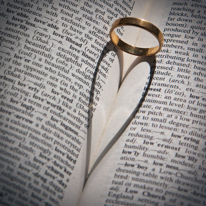 Ring Casting a Heart-shaped Shadow in a Book. Stock Photo - Image of ...