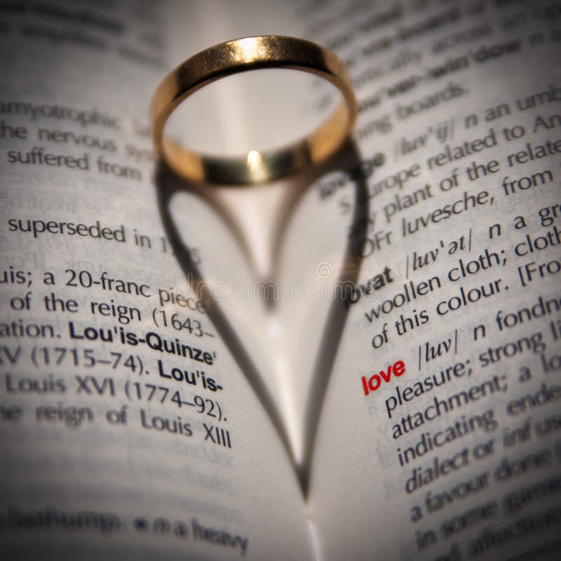 Ring Casting a Heart-shaped Shadow in a Book. Stock Photo - Image of ...