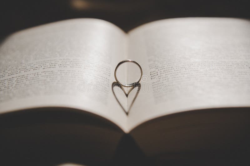 Ring heart in a book stock photo. Image of background - 144622480