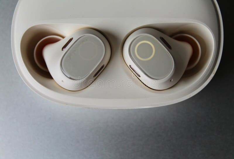 Top View of a Pair of White Wireless Earbuds in a Charging Case Stock ...