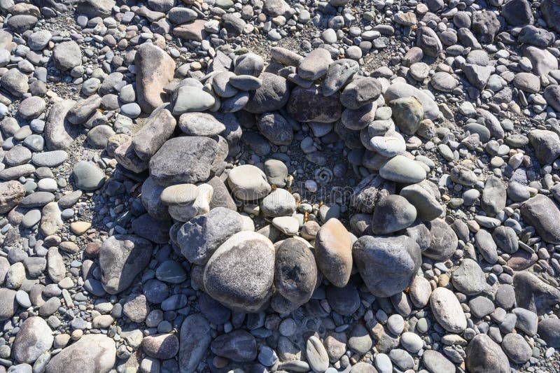 A Ring Made of Stones Polished by Water on the Bank of a Mountain River ...