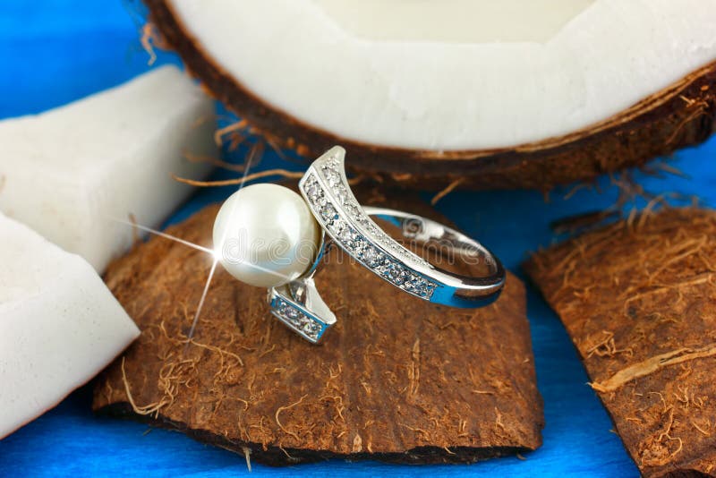 Ring with pearl on coconut stock photo. Image of refraction - 28472060