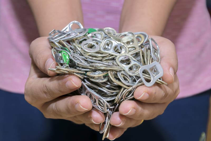 ,Ring Pull Tab Aluminum Pop Tops of Cans in the Hands of Women. Stock ...