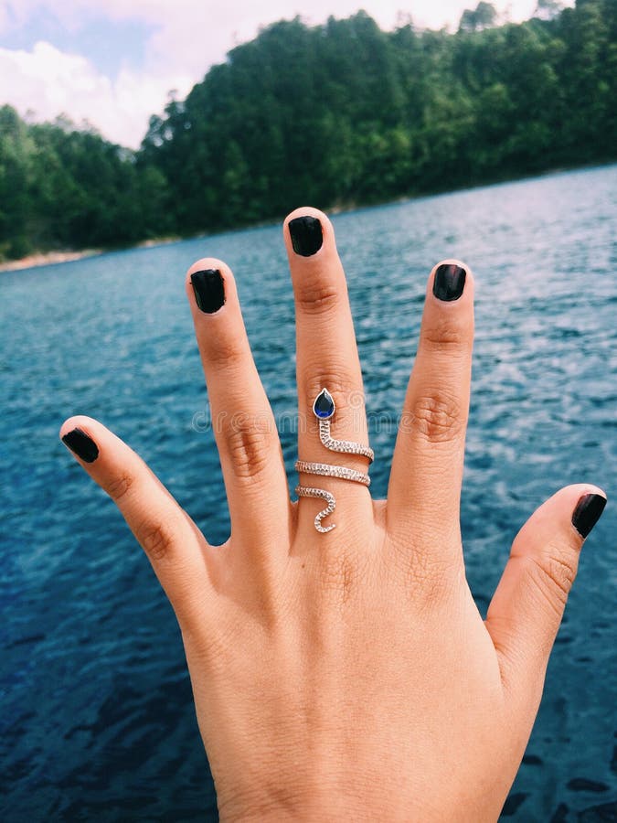 Ring stock photo. Image of ring, snake, hand, lake, blue - 79709400