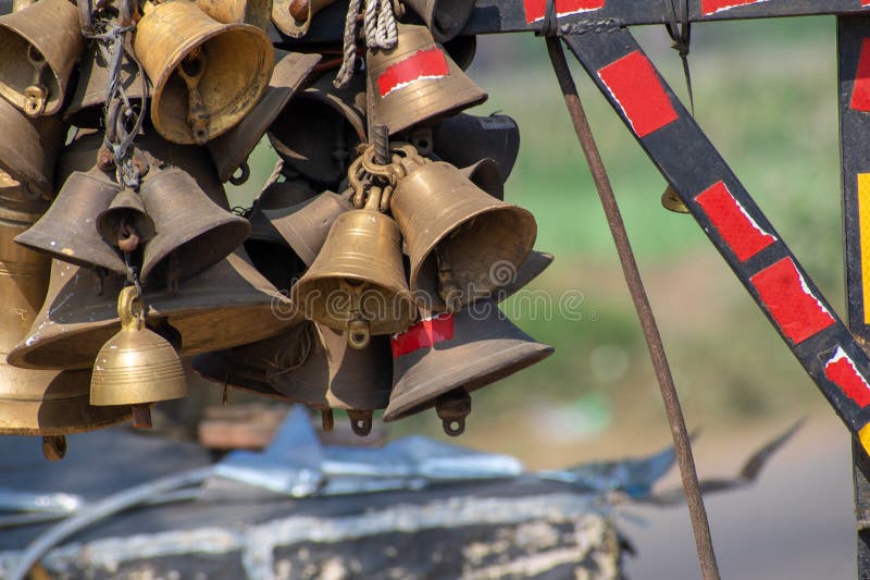 Ringing Bells of a Religious Temple. Brass Praying Bells Hanging on Old ...
