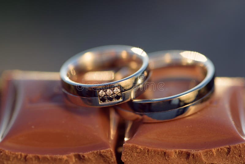 Rings with Diamonds and Chocolate Stock Image - Image of platin ...