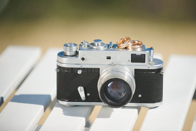 Rings on Old Camera stock photo. Image of love, marriage - 69931204