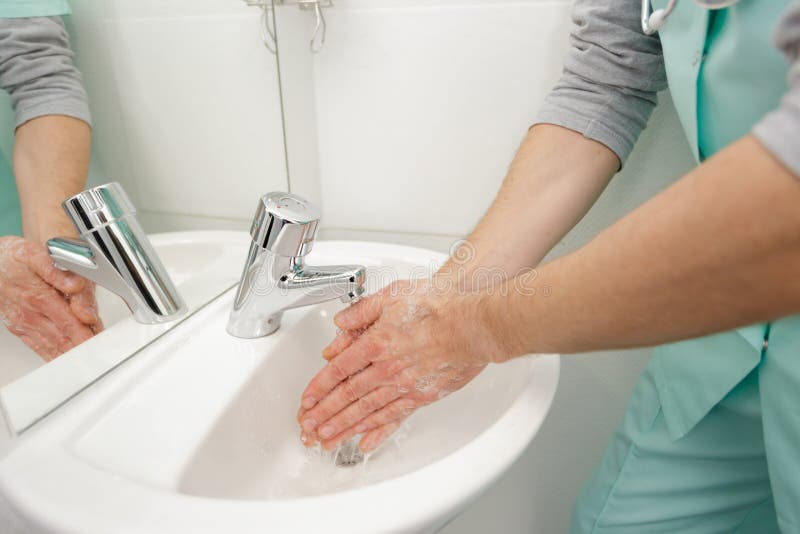 Rinsing and washing hands stock photo. Image of female - 174513506