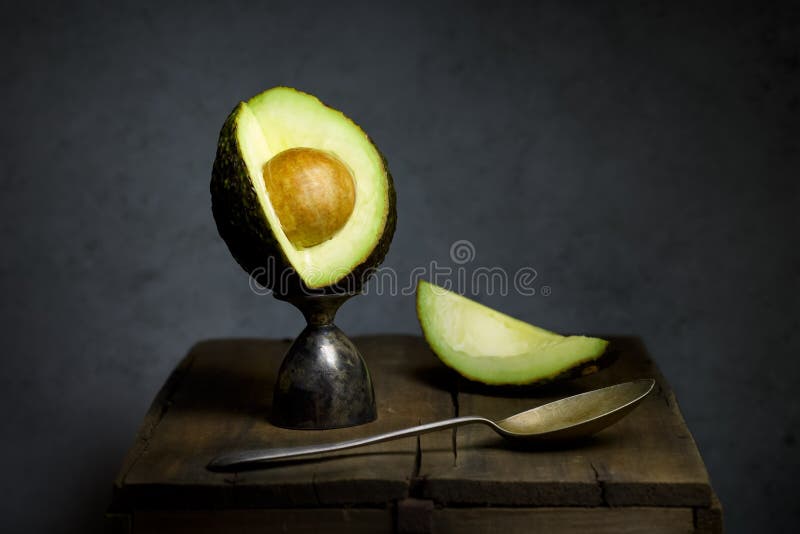 Ripe Avocado Cut Open with a Spoon Still Life Stock Photo - Image of ...