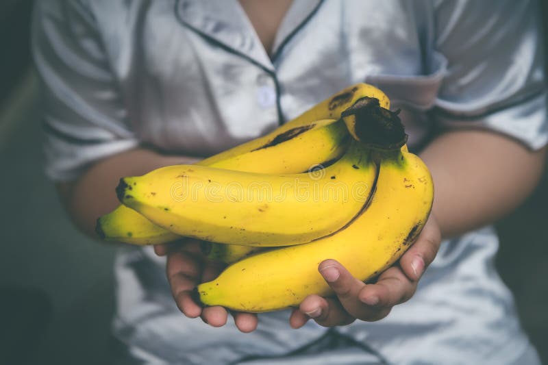 Ripe Bananas in Child S Hand Stock Photo - Image of illuminated, band ...