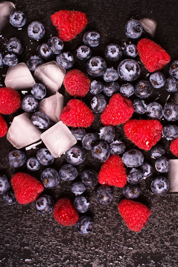 Ripe Blueberry and Raspberry with Ice Cubes Stock Image - Image of ...