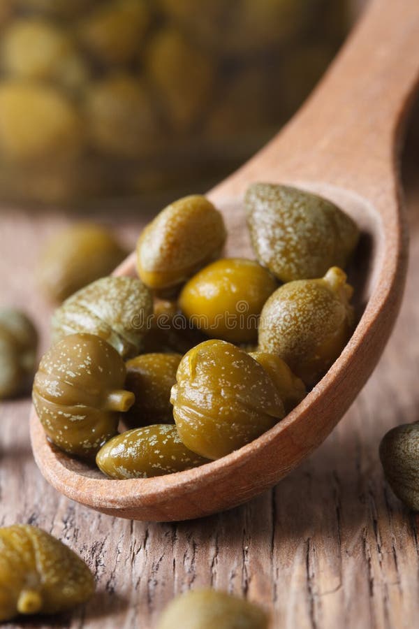 Ripe Capers in a Wooden Spoon Closeup on Old Table. Stock Image - Image ...