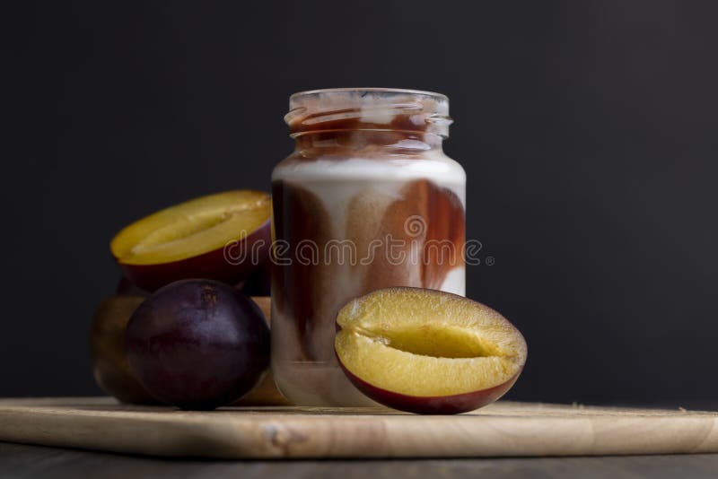 Ripe Dark - Colored Plums Sliced on the Table Stock Photo - Image of ...