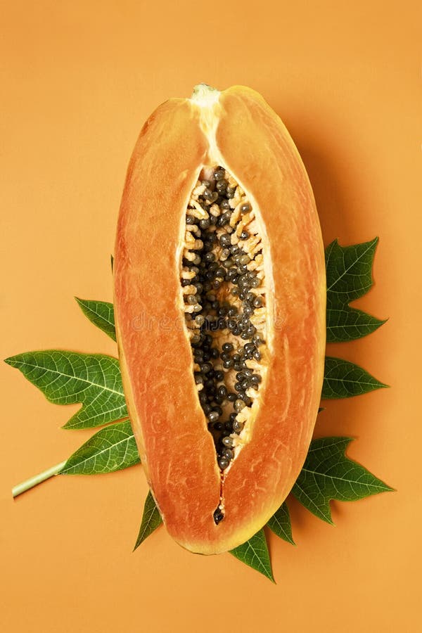 Ripe Freshly Cut Papaya Fruit with Green Papaya Leaf on Black ...
