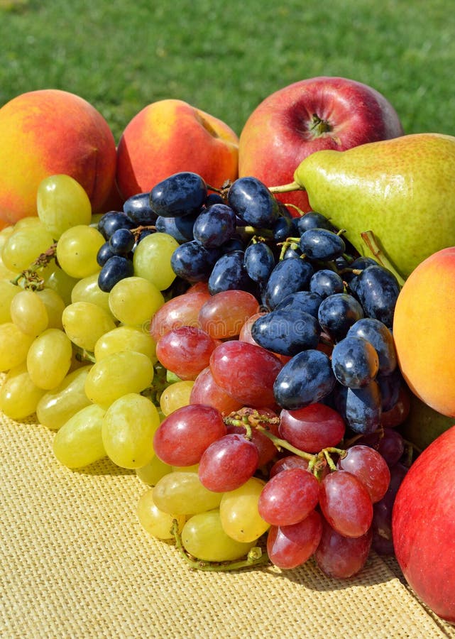Ripe Grape, Peaches, Pears on the Grass Stock Photo - Image of ...