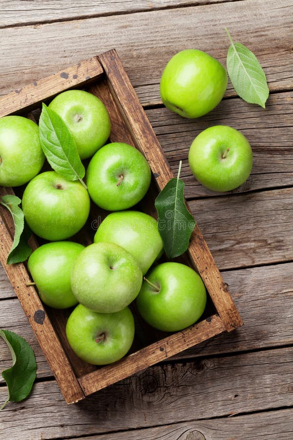 Green apples in wooden box stock photo. Image of green - 120791080