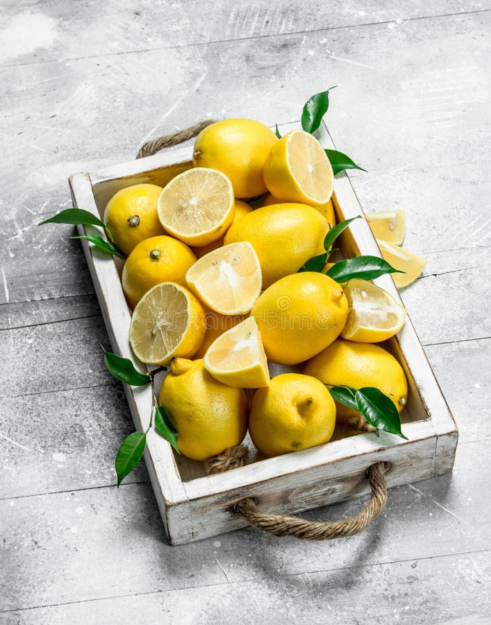 Ripe Juicy Lemons with Leaves in Tray Stock Photo - Image of ingredient ...