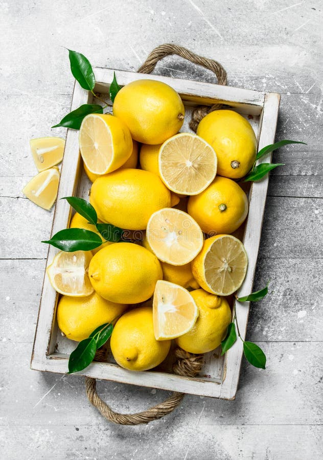 Ripe Juicy Lemons with Leaves in Tray Stock Image - Image of harvest ...