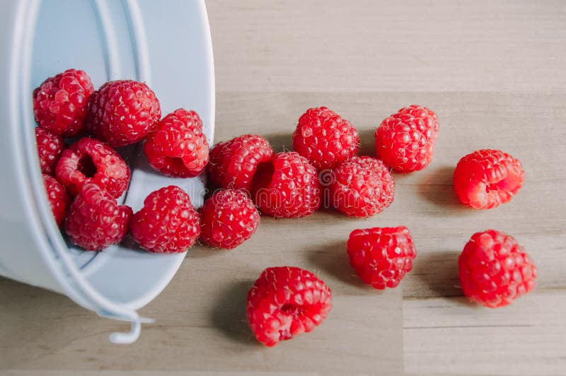 Ripe and Juicy Raspberry in an Inverted Small Bucket Stock Photo ...