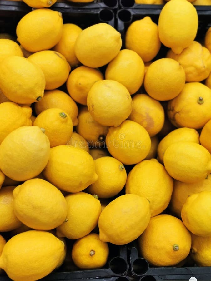 Ripe lemons in a box stock photo. Image of black, yellow - 168040768