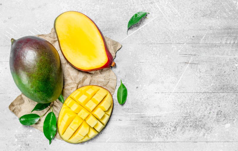 Ripe mango on paper stock image. Image of taste, mango - 141806701