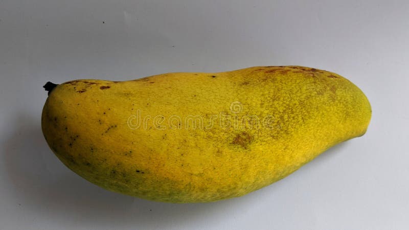A Ripe Mango with a Yellow Skin and a Curved Shape. Stock Photo - Image ...