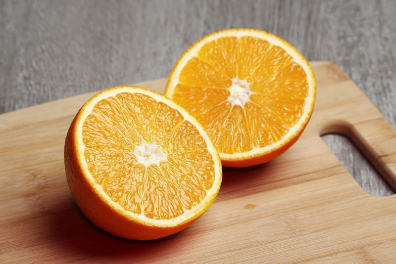 An Orange Cut into Two Halves Stock Photo - Image of food, diet: 135841256