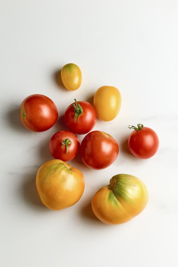Ripe Organic Red and Yellow Colored Tomatoes on a Marble Surface. Stock ...
