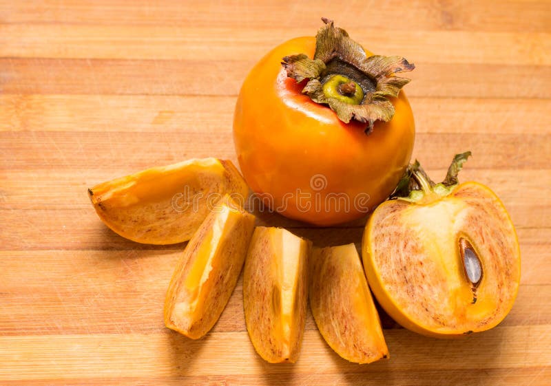 A ripe persimmon stock photo. Image of reclaimed, product - 61695918