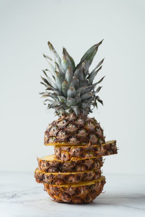 Pineapple Cut into Pieces on a White Background. Close Up Stock Photo ...