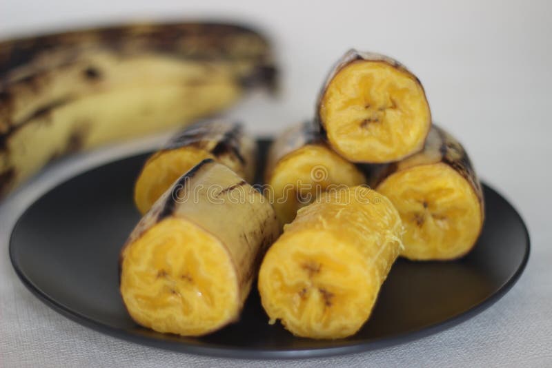 Ripe Plantain Steamed and Served on Dark Grey Medium Size Plate Stock ...