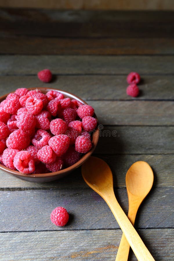 Ripe Raspberries in a Bowl on the Boards Stock Image - Image of group ...