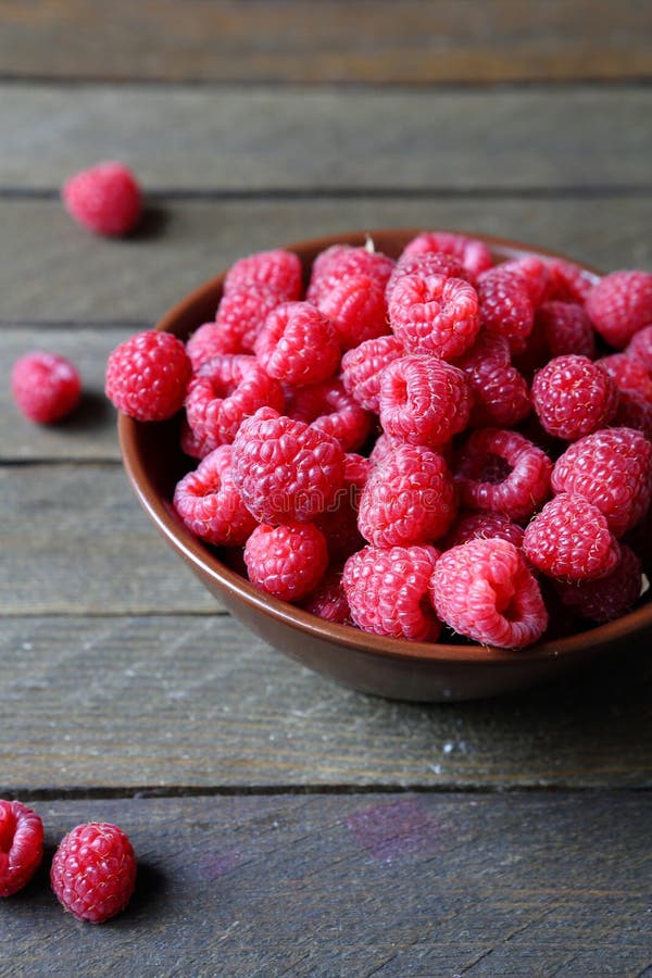 Ripe Raspberries in a Bowl on the Table Stock Image - Image of bowl ...